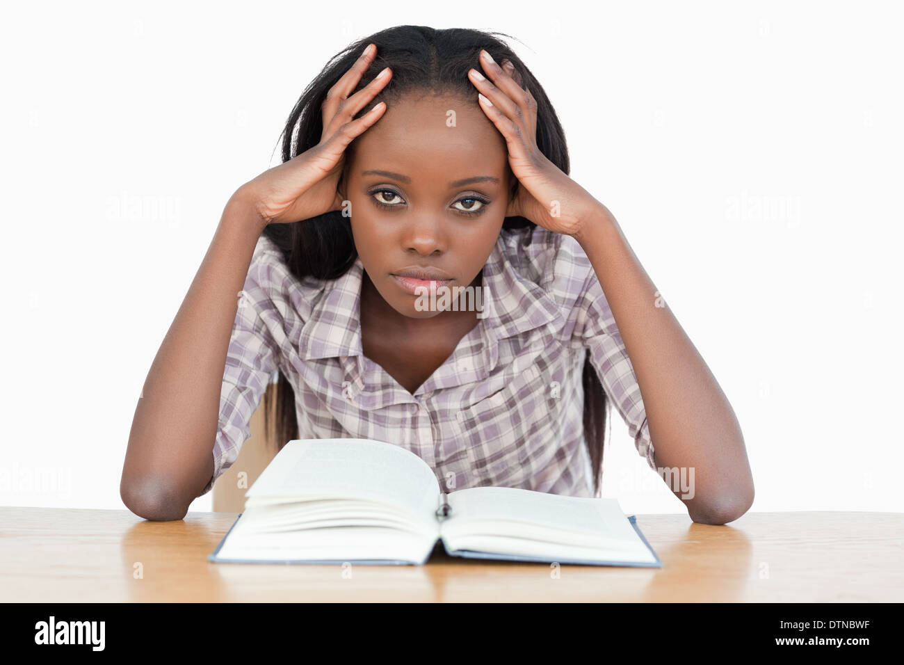 Bored student trying to read a book Stock Photo - Alamy
