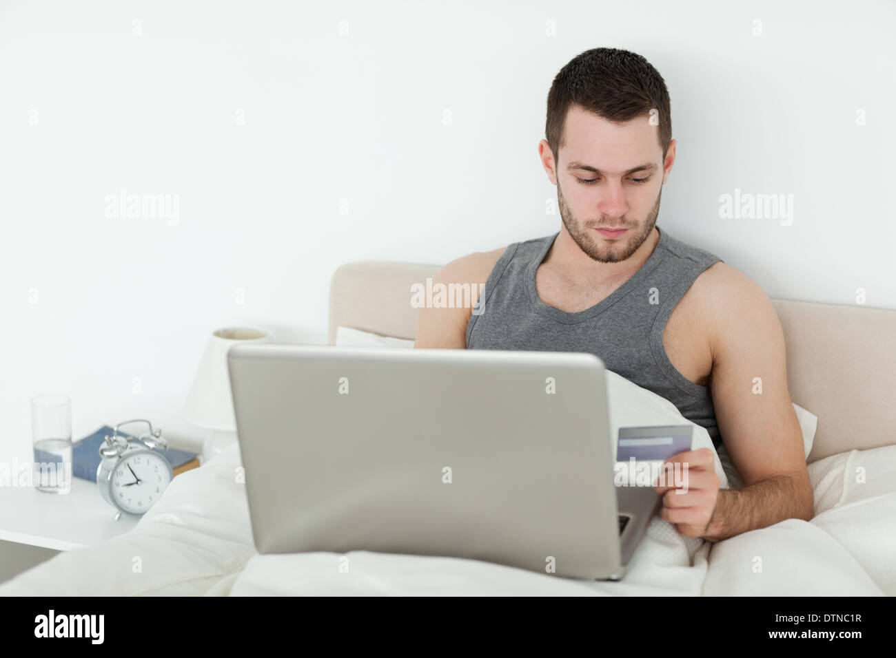 Man shopping online Stock Photo - Alamy