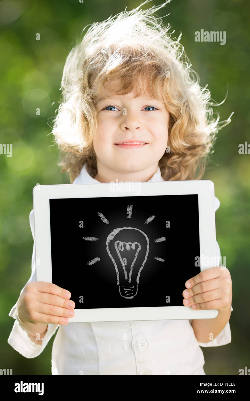 Kid holding tablet hi-res stock photography and images - Alamy