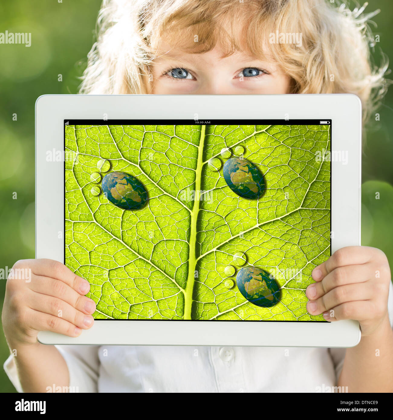 Child holding tablet PC Stock Photo - Alamy