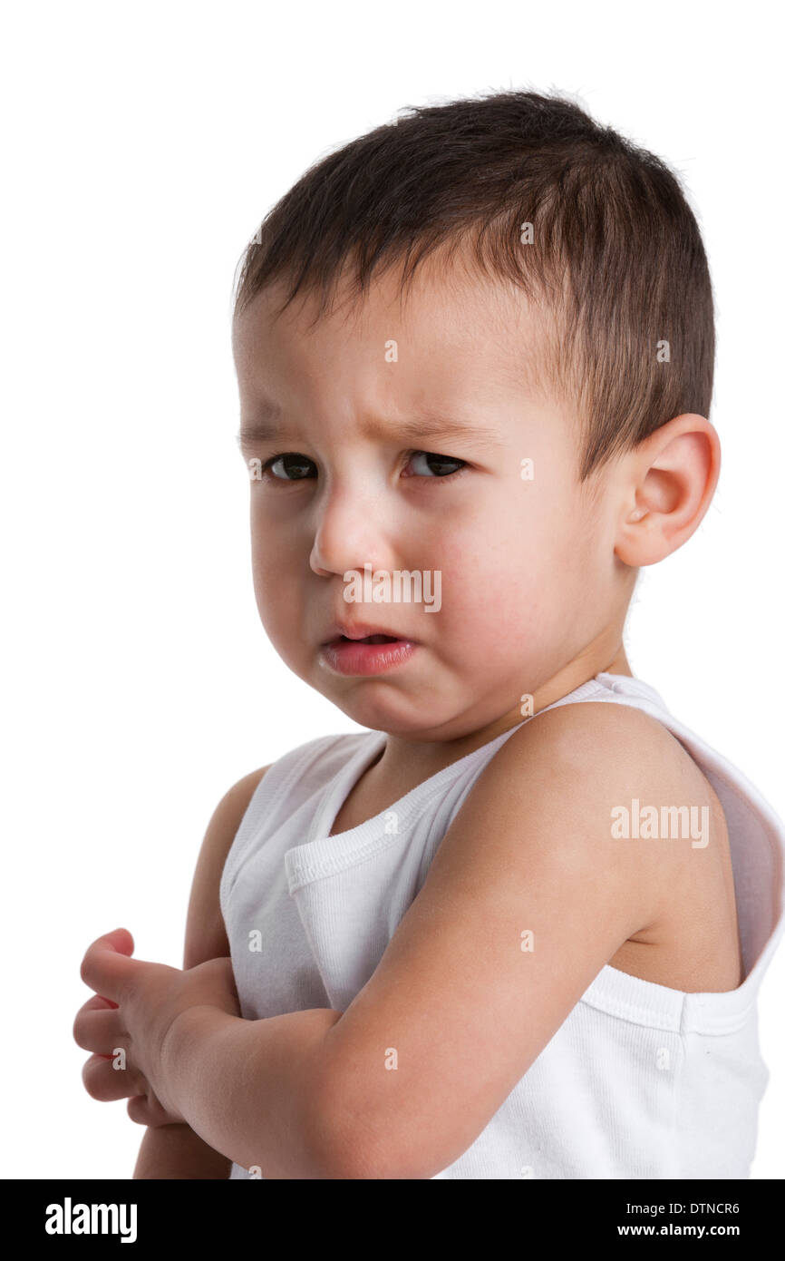 Angry looking toddler boy on white background Stock Photo - Alamy