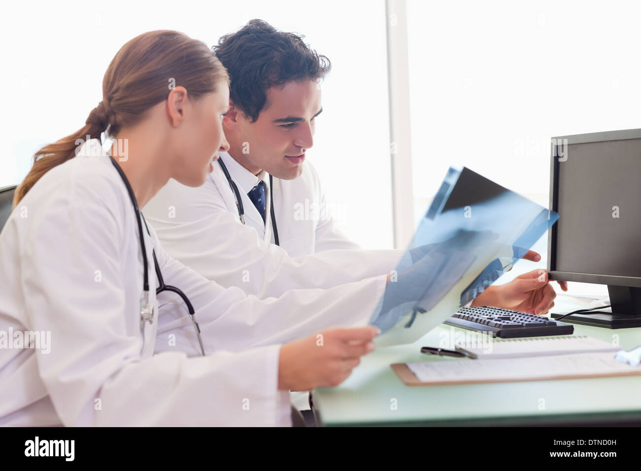 Medical team analyzing x-rays Stock Photo - Alamy