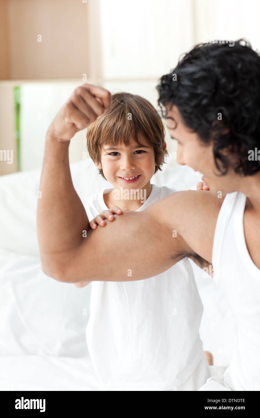 Attentive father playing with his son Stock Photo - Alamy