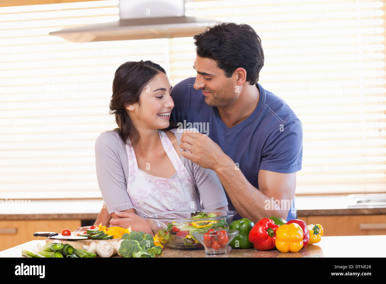 Man feeding his girlfriend Stock Photo - Alamy