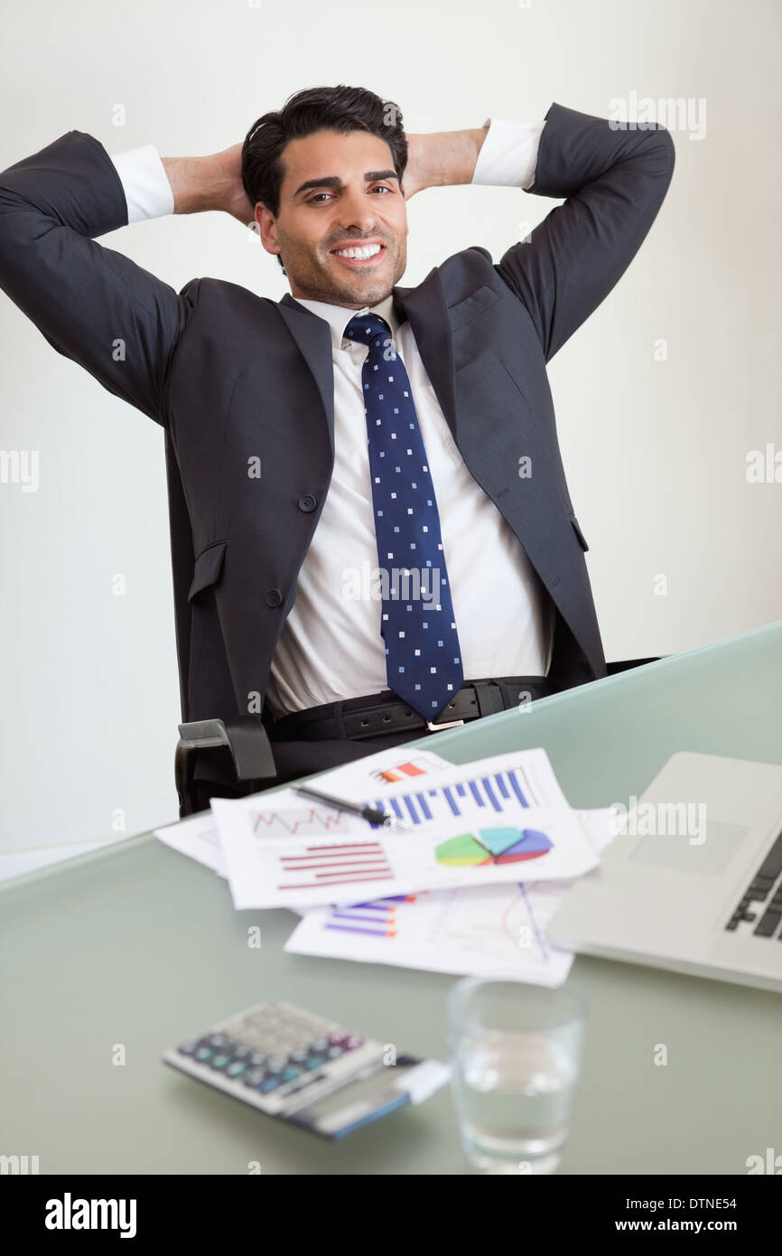 Portrait of a smiling sales person relaxing Stock Photo - Alamy