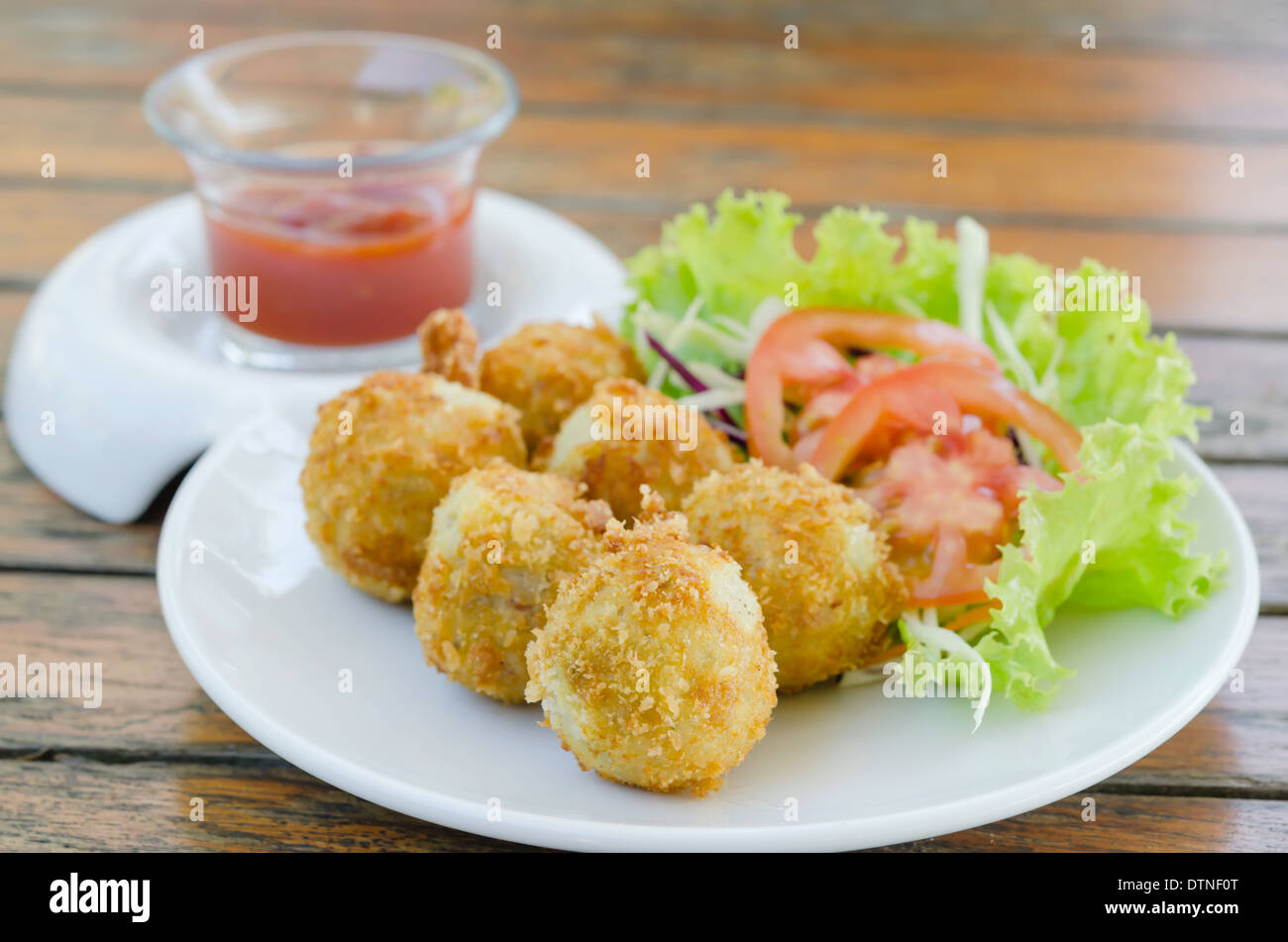 Deep Fried Potato Croquettes served with tomato sauce and fresh ...
