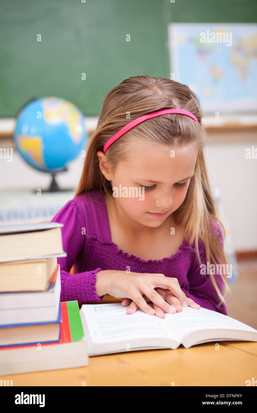 Portrait of schoolgirl reading a book Stock Photo - Alamy