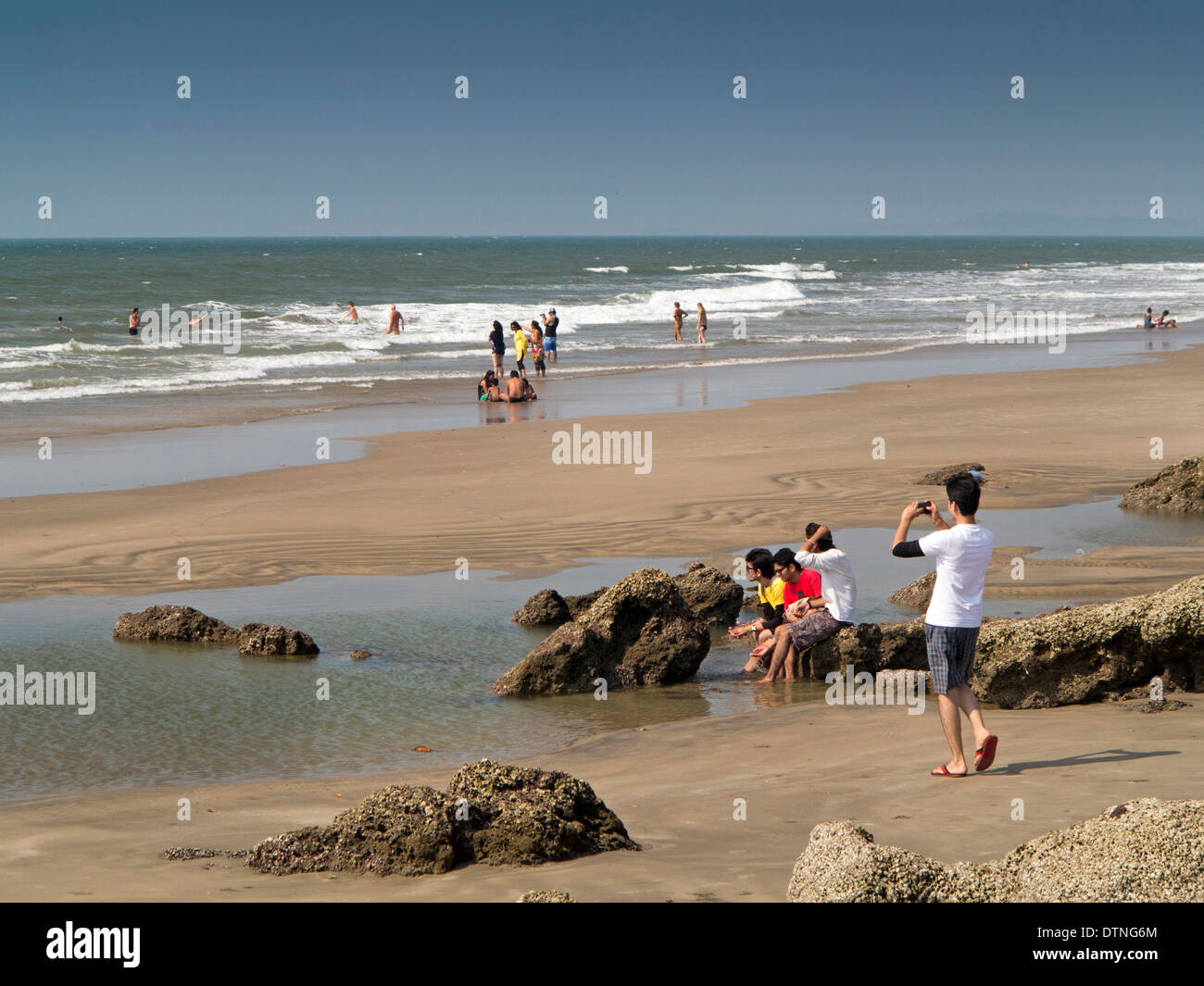 India, Goa, Gawdewada beach, Indian tourists amongst eroded seashore ...