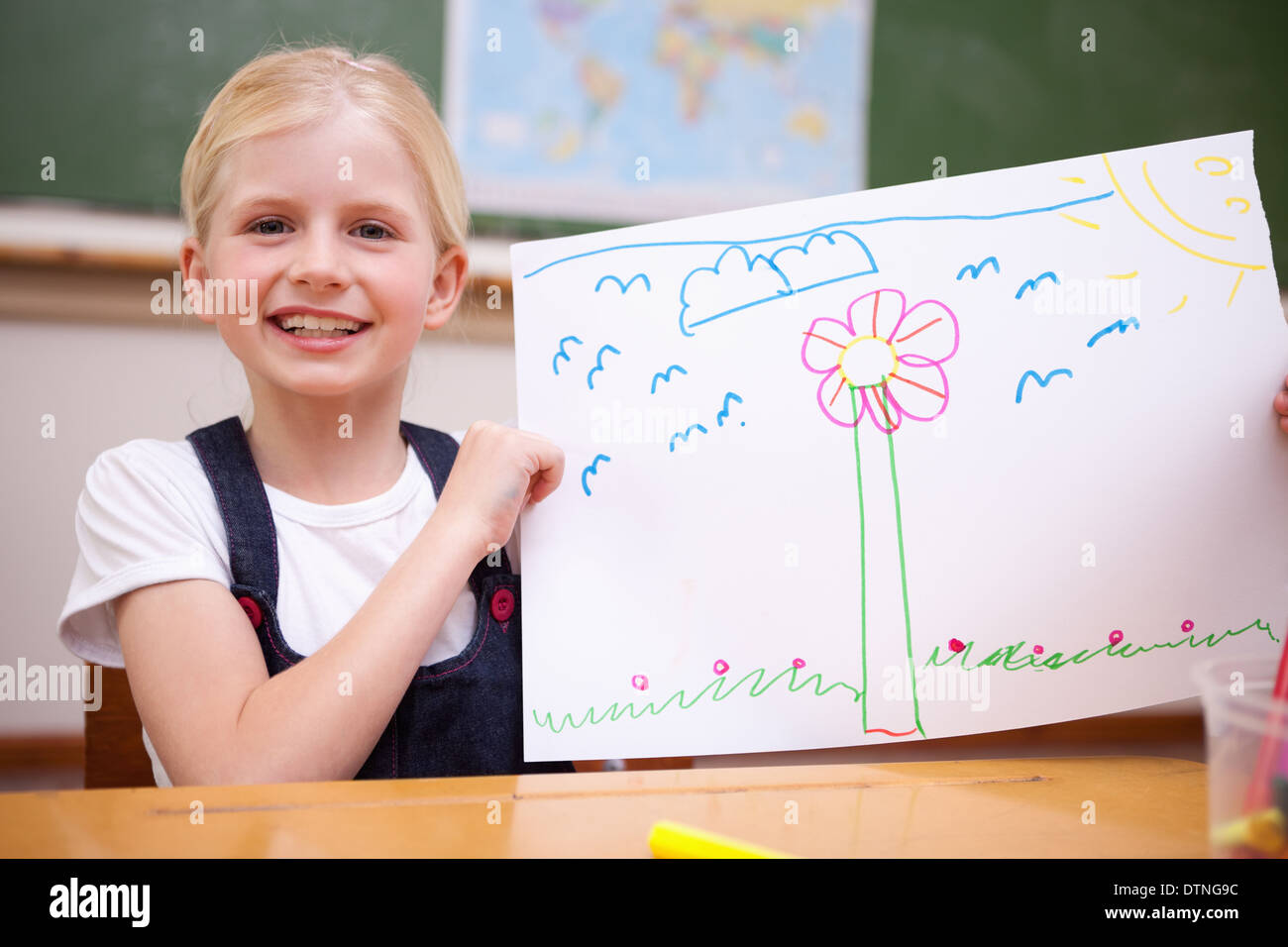 Girl showing her drawing Stock Photo - Alamy