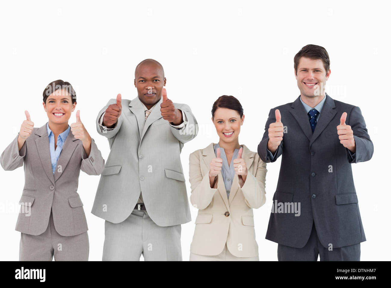 Salesteam giving thumbs up Stock Photo - Alamy