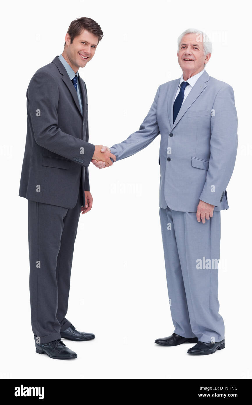 Hand shake two businessmen work Cut Out Stock Images & Pictures - Alamy