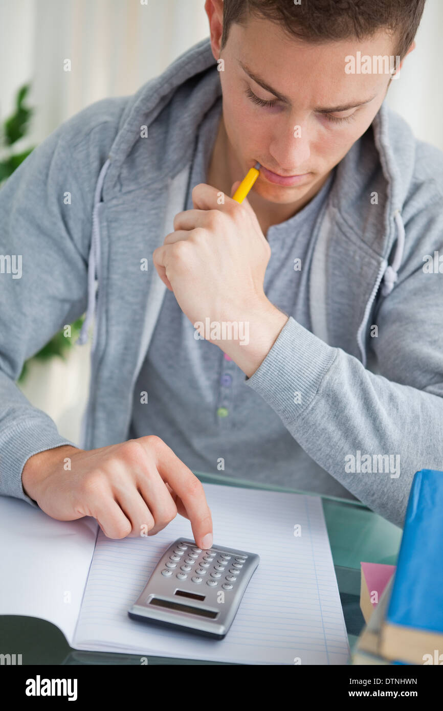 Student using a calculator Stock Photo - Alamy