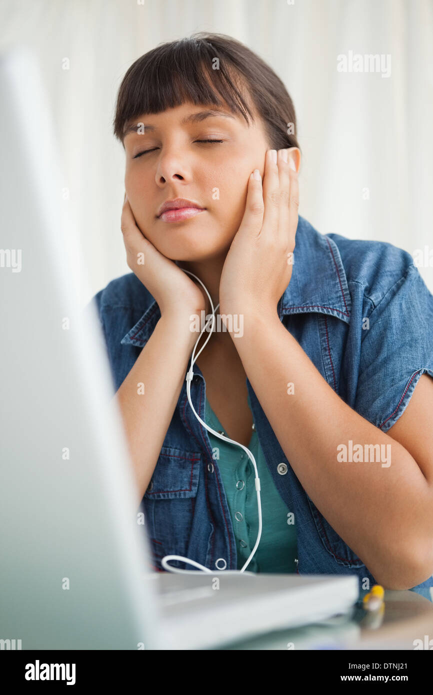 Female student enjoying music Stock Photo - Alamy