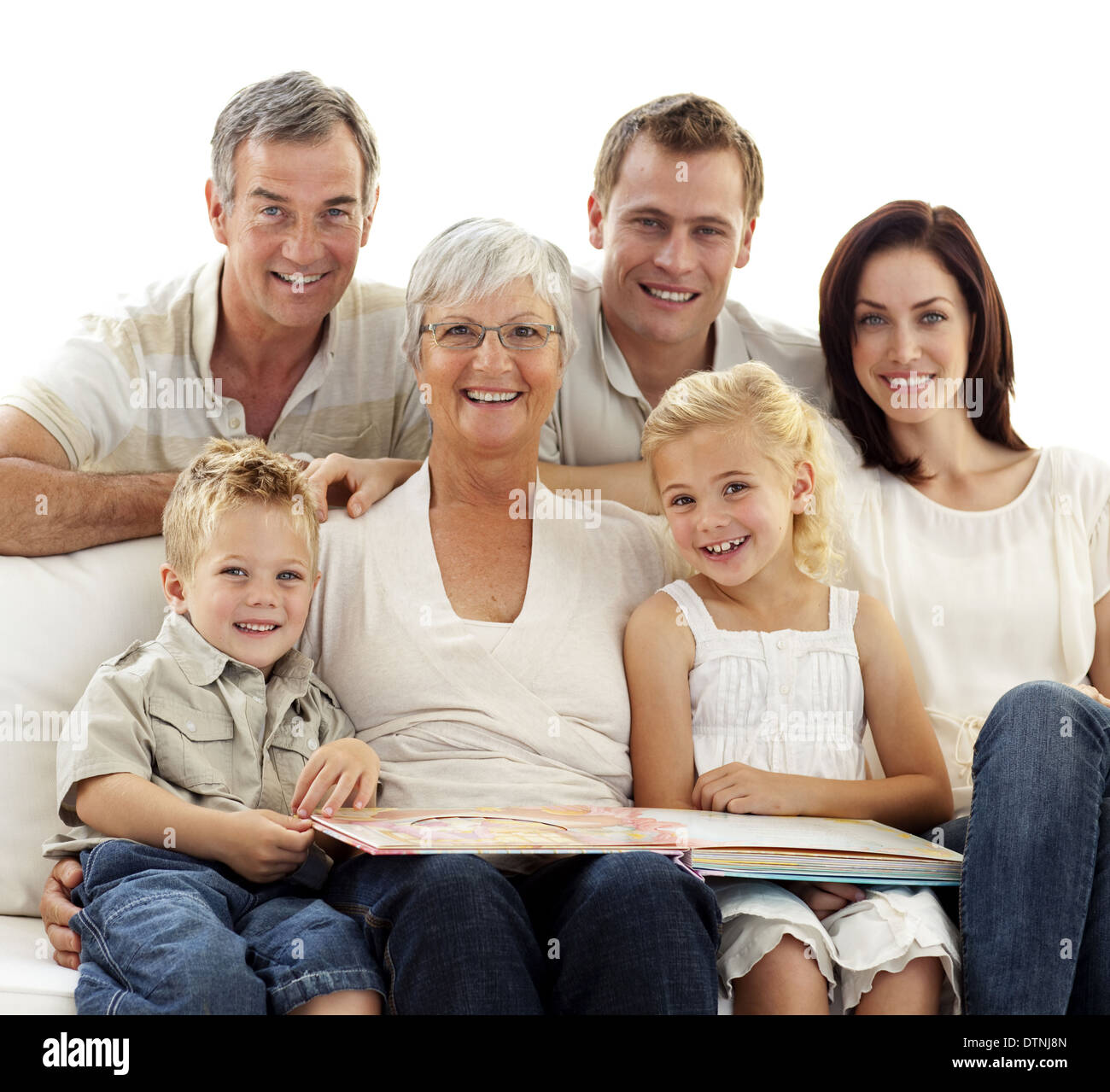 Smiling family observing photograph album Stock Photo - Alamy