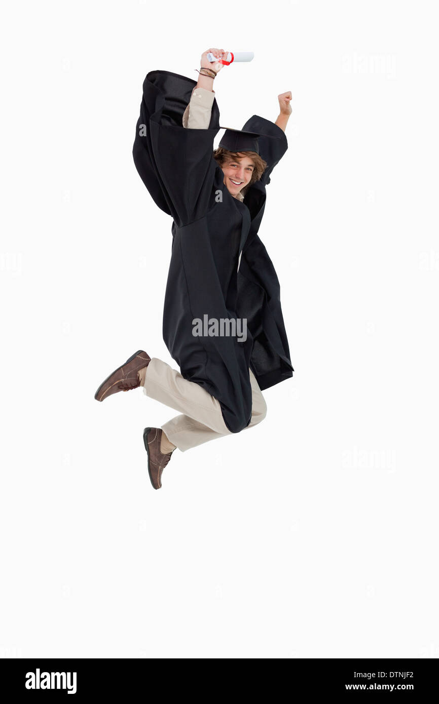 Happy jumping graduate holding diploma hi-res stock photography and ...