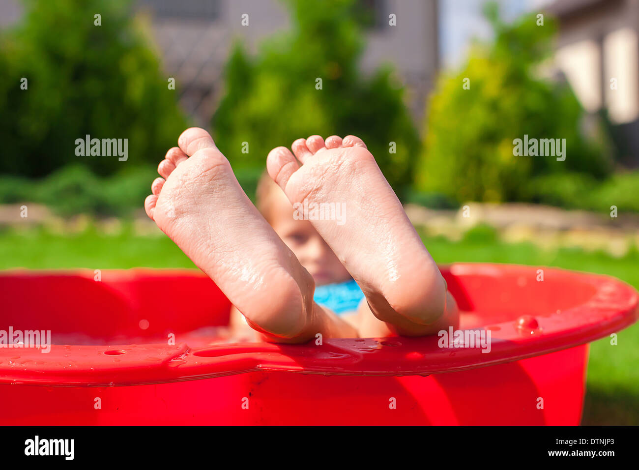 closeup-of-little-kid-s-legs-in-small-red-pool-stock-photo-alamy