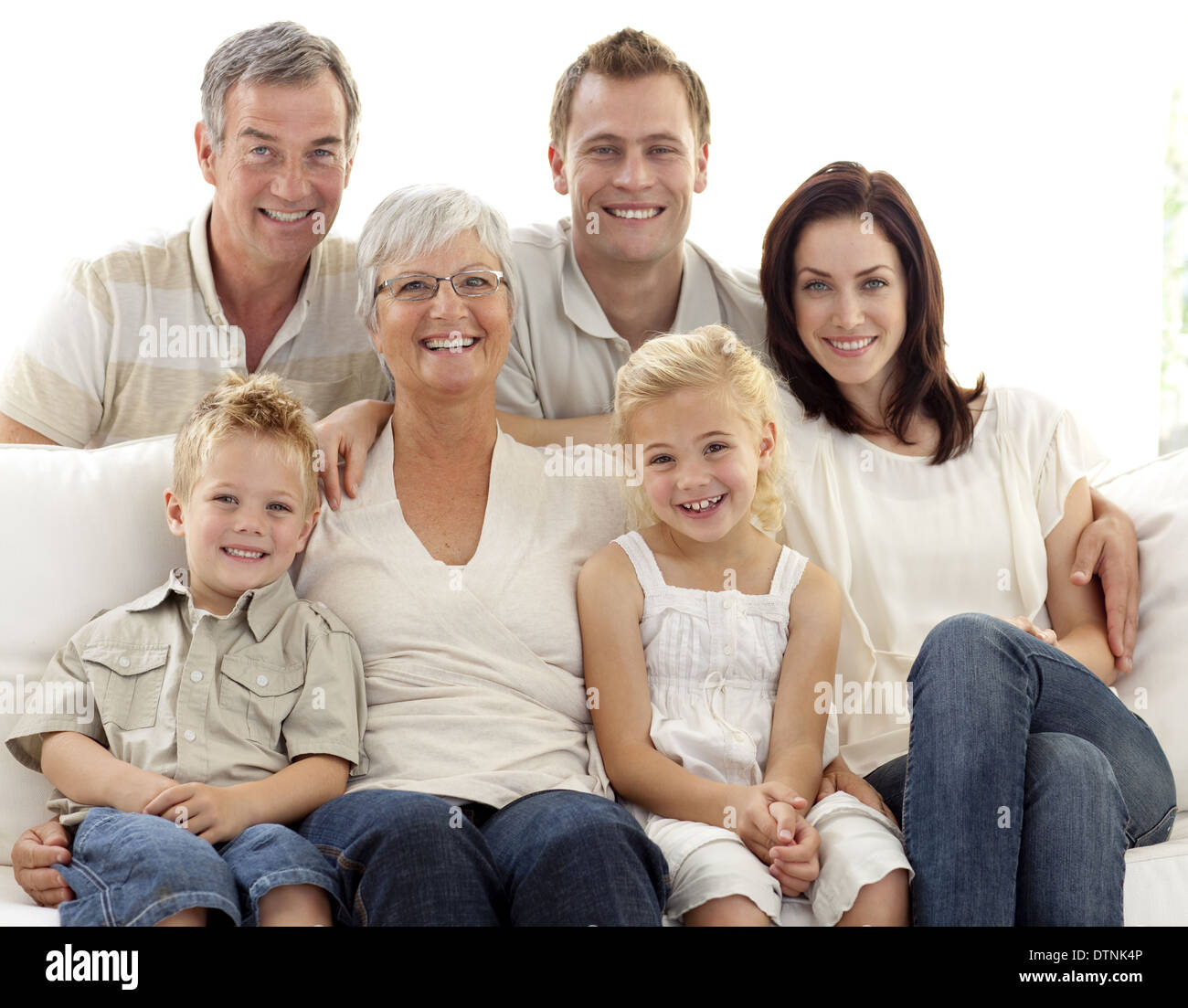 Portrait of family on sofa Stock Photo - Alamy