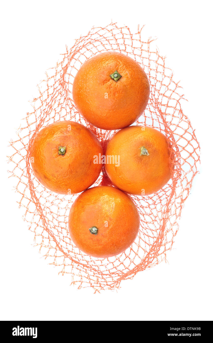 Oranges in a net bag Stock Photo - Alamy