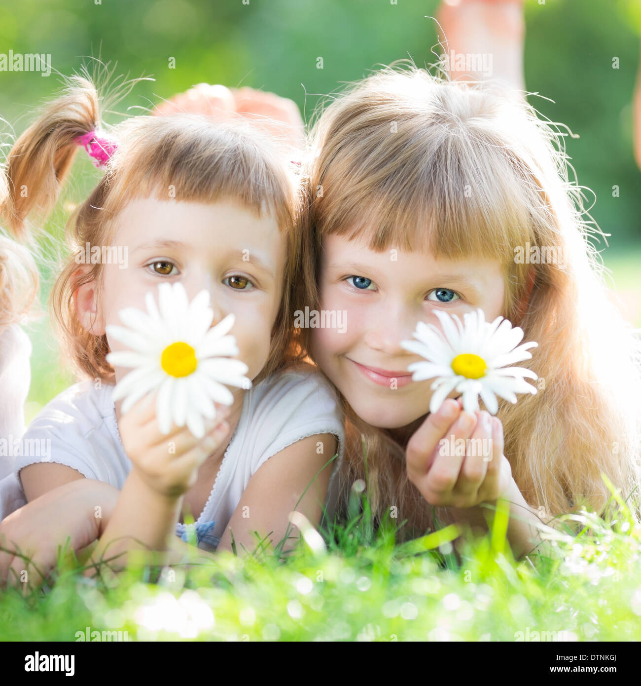 Happy children with flowers Stock Photo - Alamy