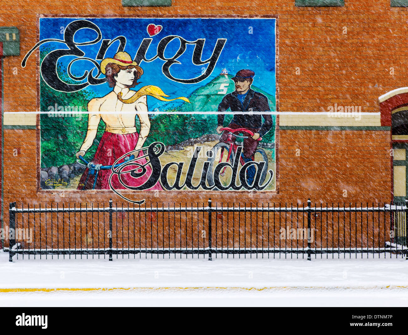 Snowy winter view of colorful mural in historic downtown Salida ...