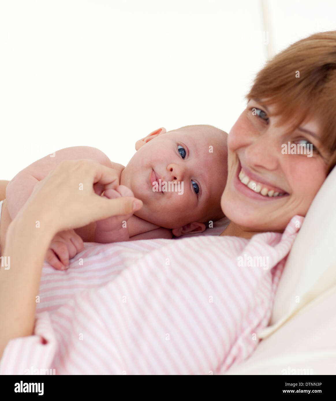 Mother embracing her newborn baby Stock Photo - Alamy