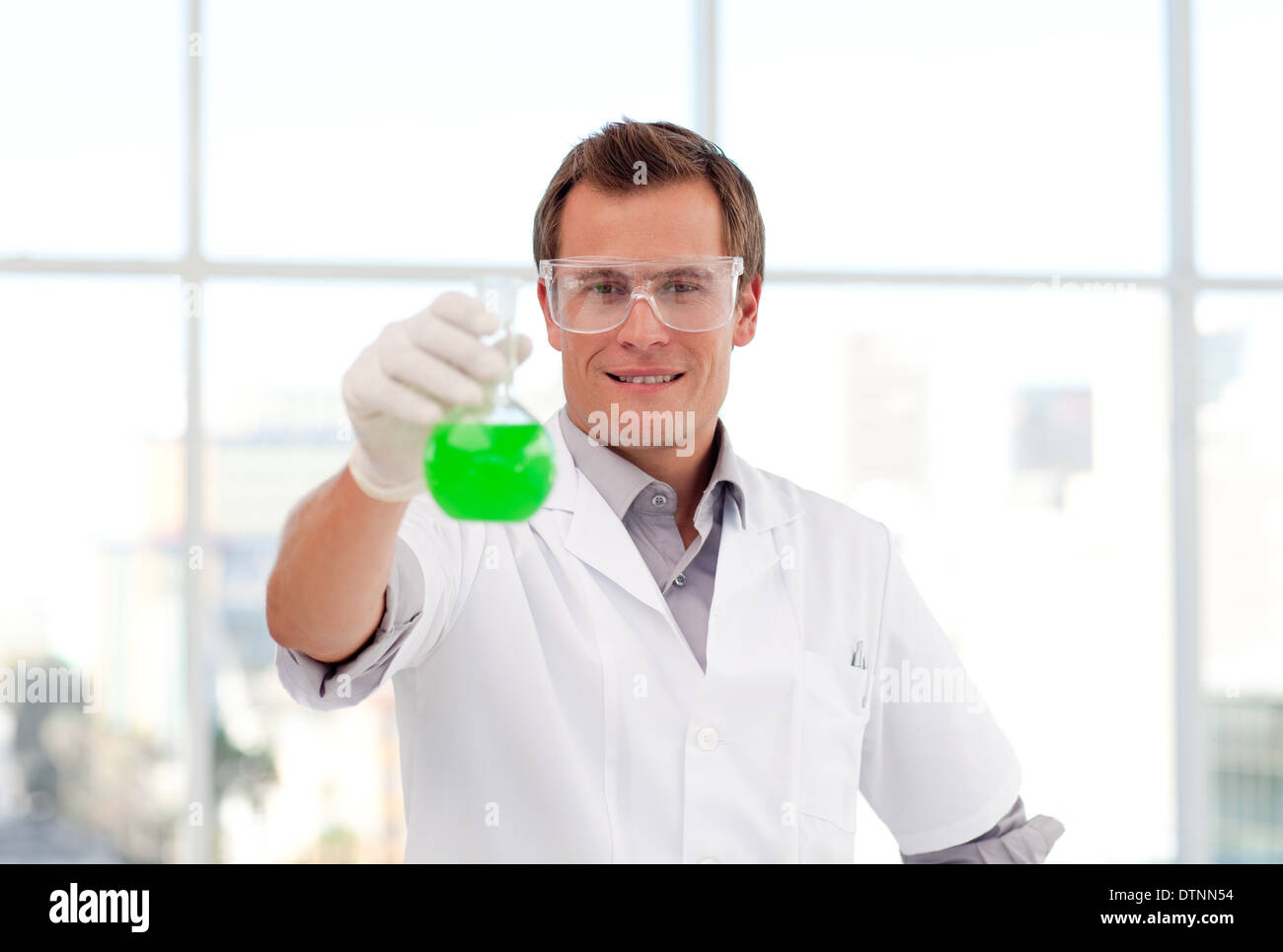Smiling scientist examining test hi-res stock photography and images ...