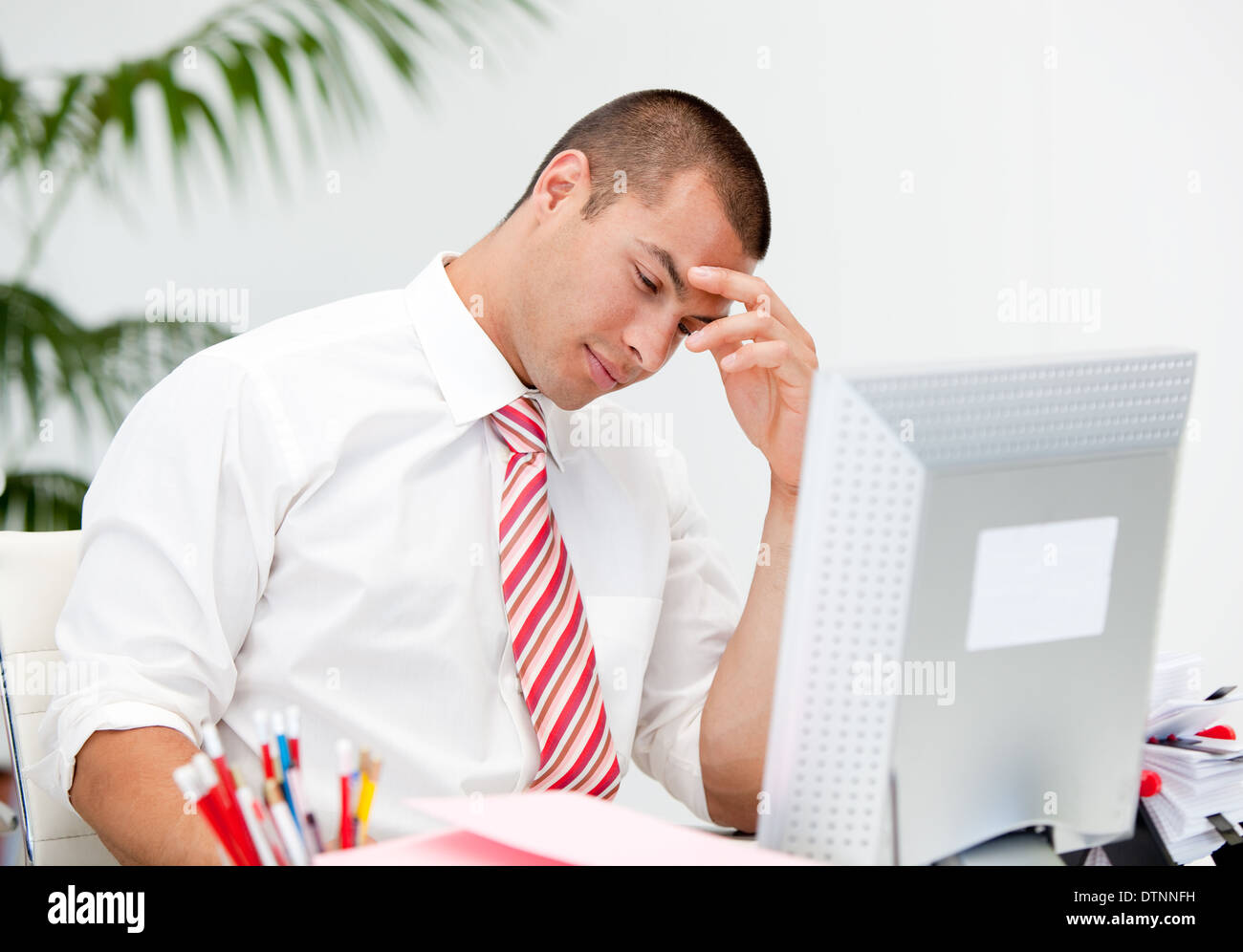 Stressed businessman working at a computer Stock Photo - Alamy