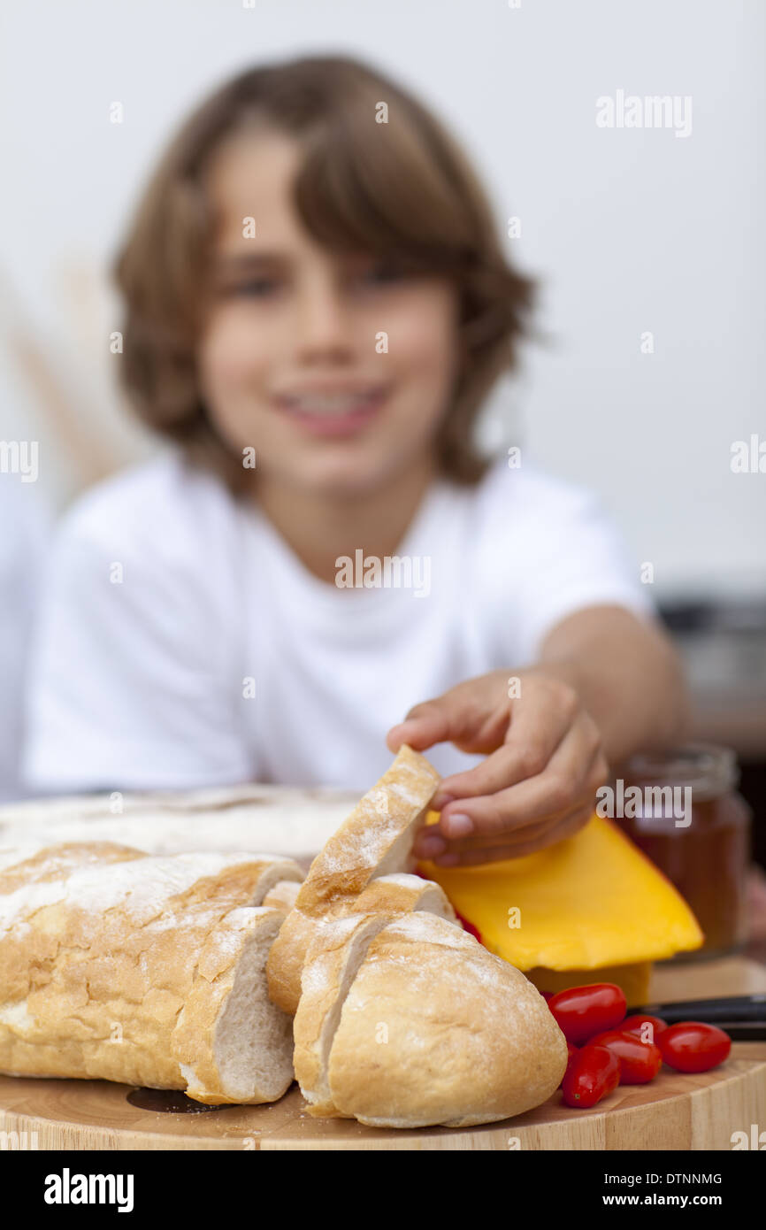 Close-up of child's hand taking bread Stock Photo - Alamy