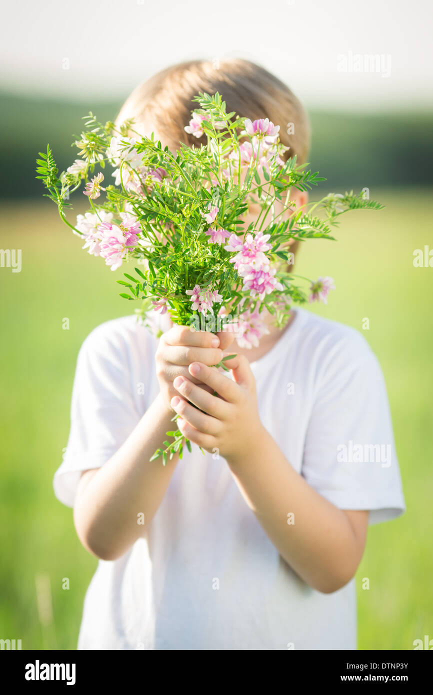 Boy hiding flower hi-res stock photography and images - Alamy