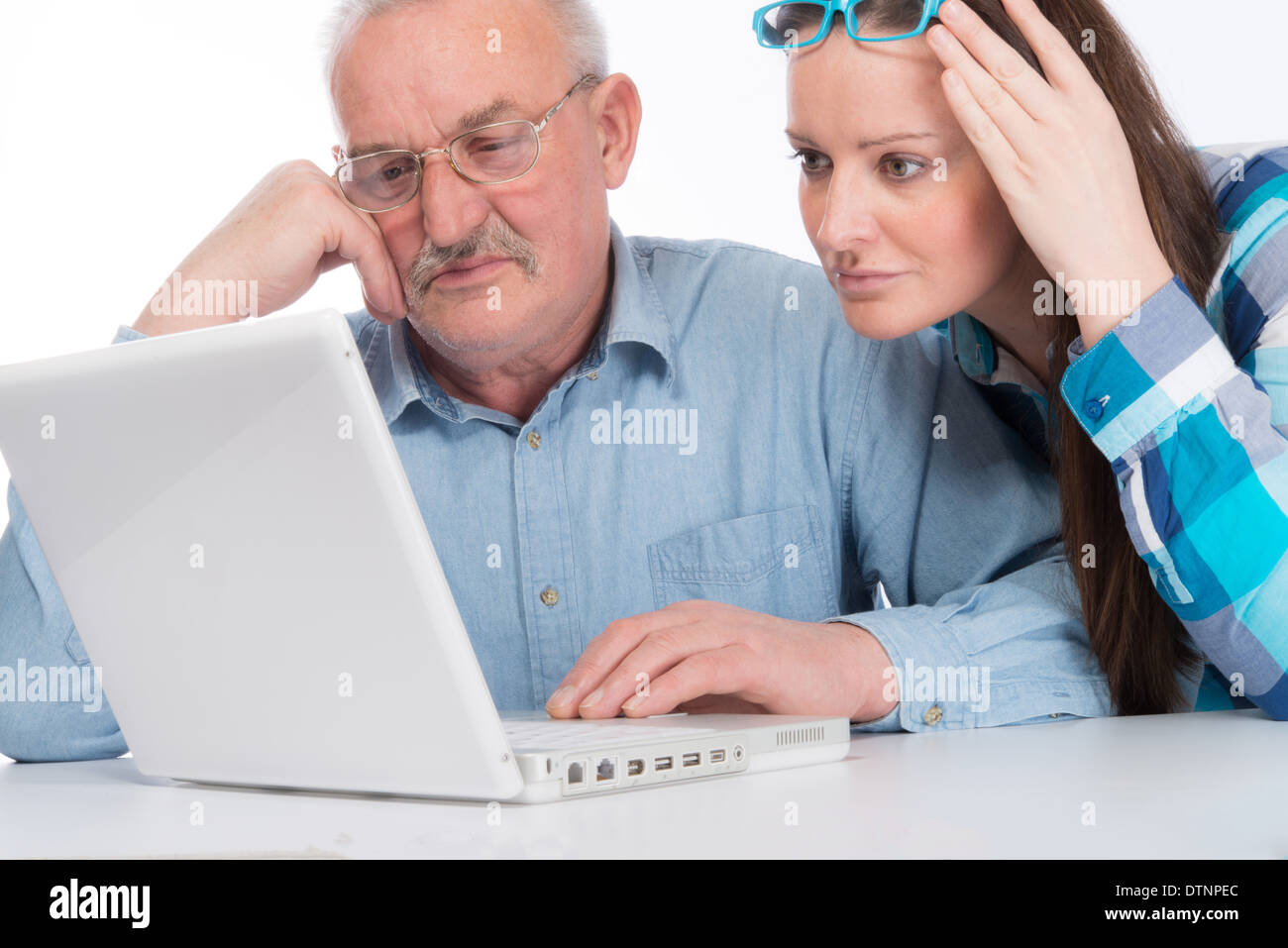 Helping with new computer Stock Photo - Alamy