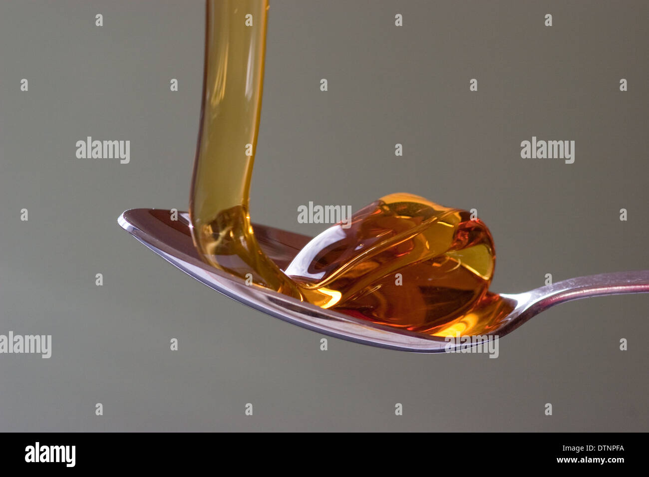 Dripping syrup spoon hi-res stock photography and images - Alamy