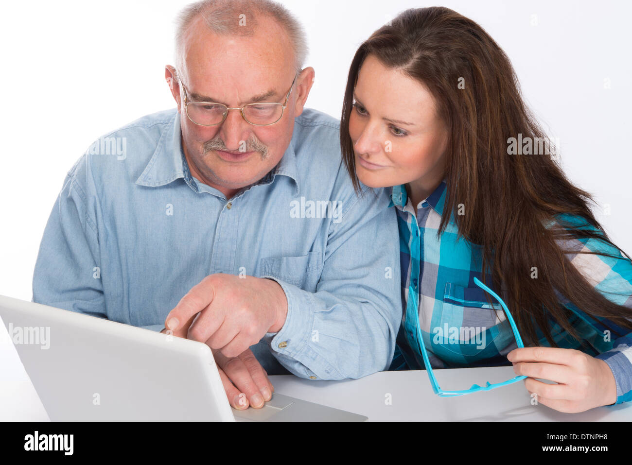Helping with new computer Stock Photo - Alamy