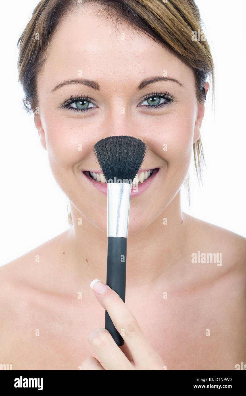 Attractive Young Woman Applying Face Powder Stock Photo - Alamy