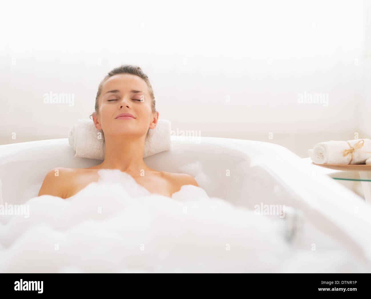 Woman relaxing in bathtub hi-res stock photography and images - Alamy