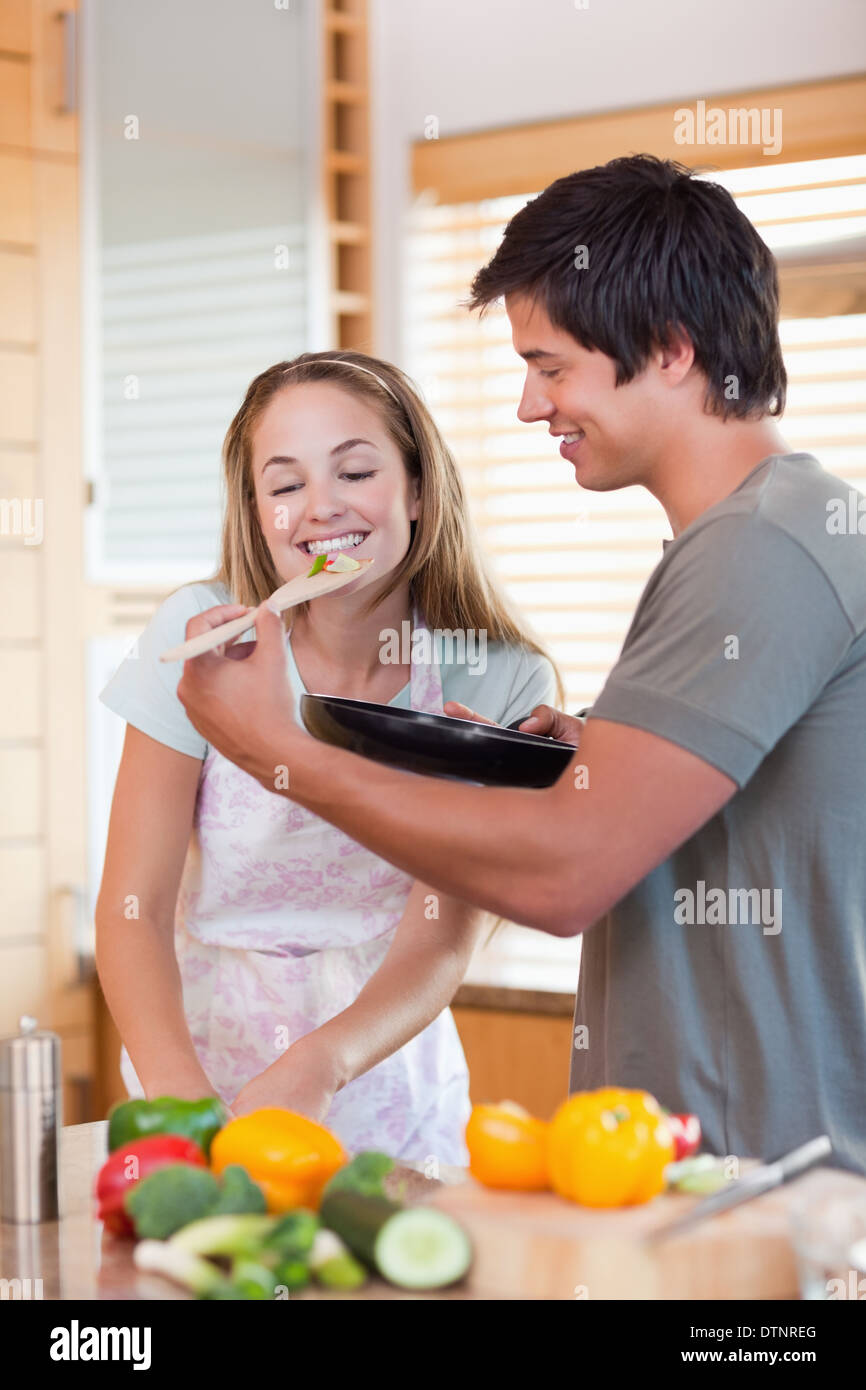 Portrait of a couple preparing dinner Stock Photo - Alamy