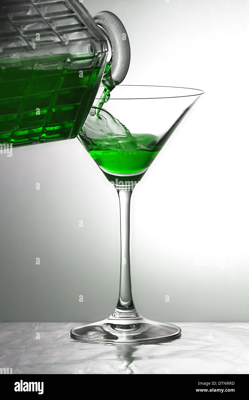 Pouring a green drink Stock Photo - Alamy