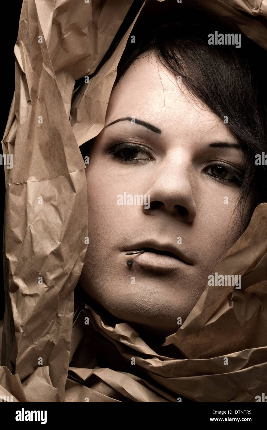 A male portrait, his face is wrapped with brown paper, a creative ...