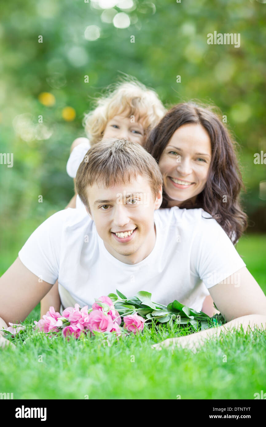 Happy family three lying hi-res stock photography and images - Alamy