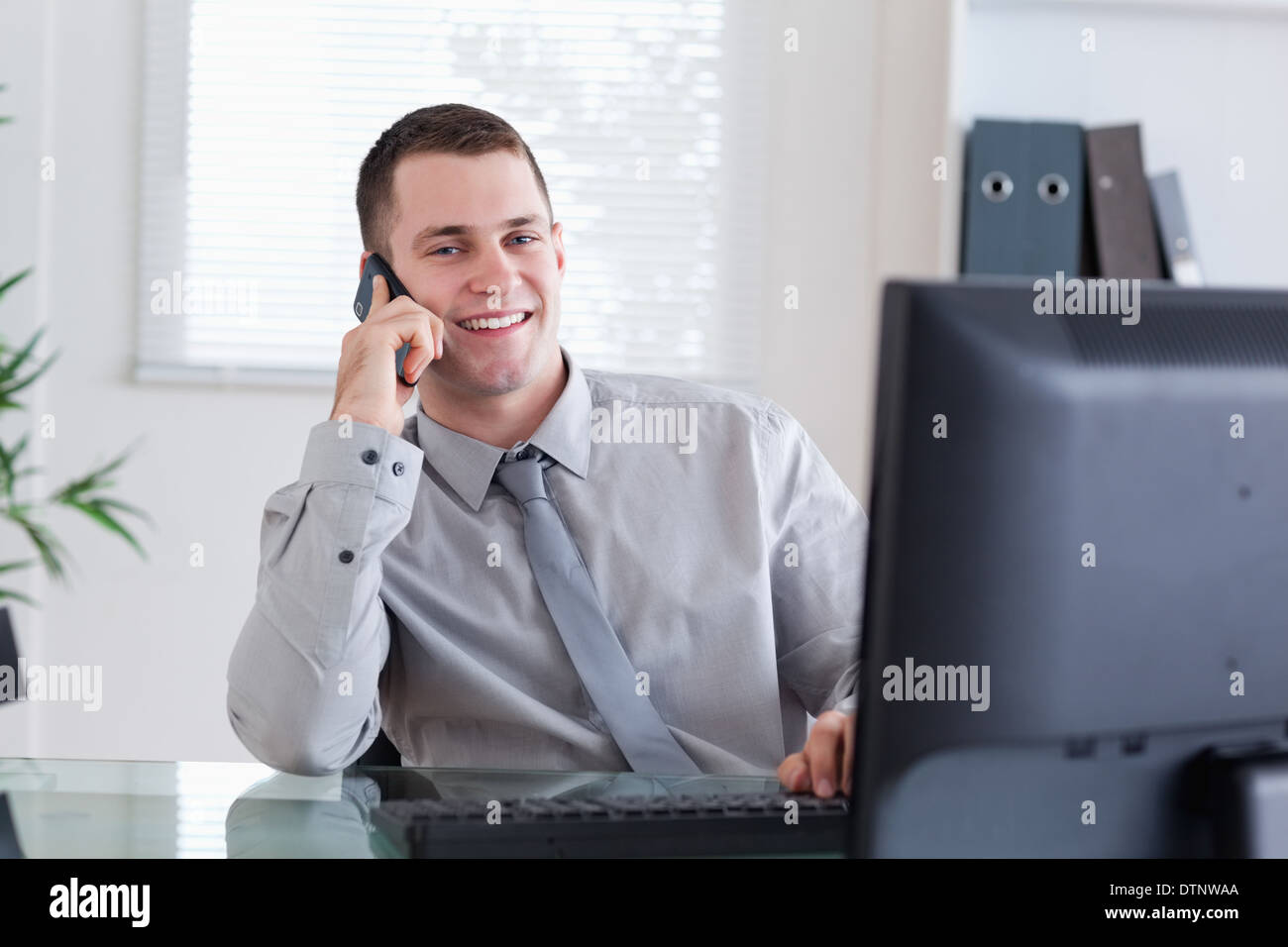 Happy businessman getting pleasant call Stock Photo - Alamy