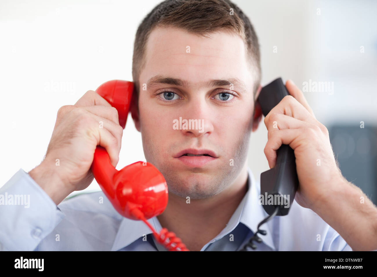 Close up stressed with the telephone Stock Photo - Alamy