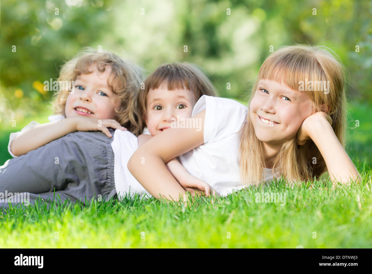 Kids in spring park Stock Photo - Alamy