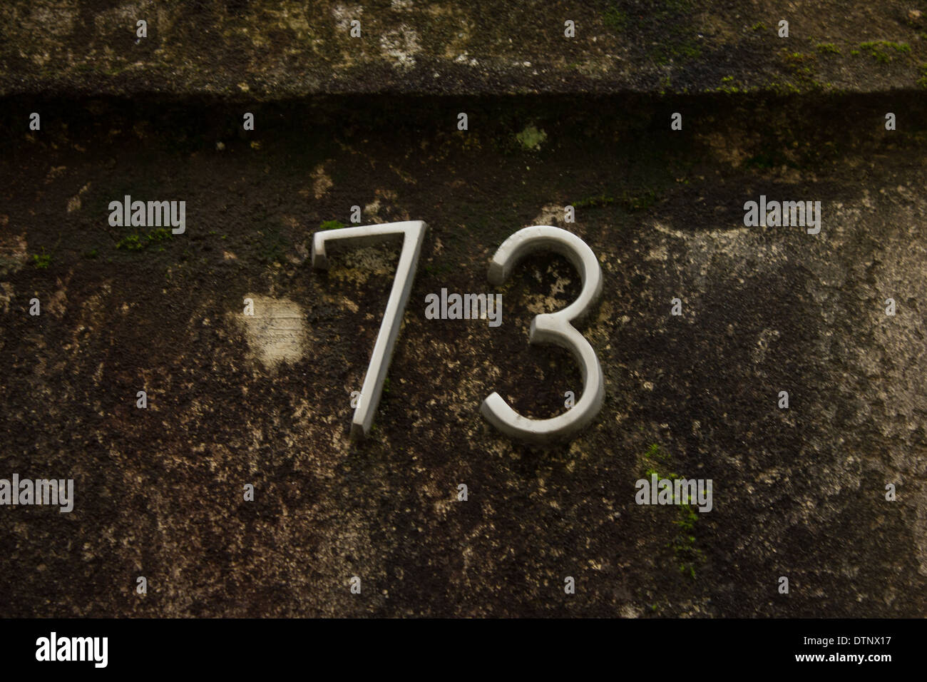 Door number 73 Stock Photo - Alamy