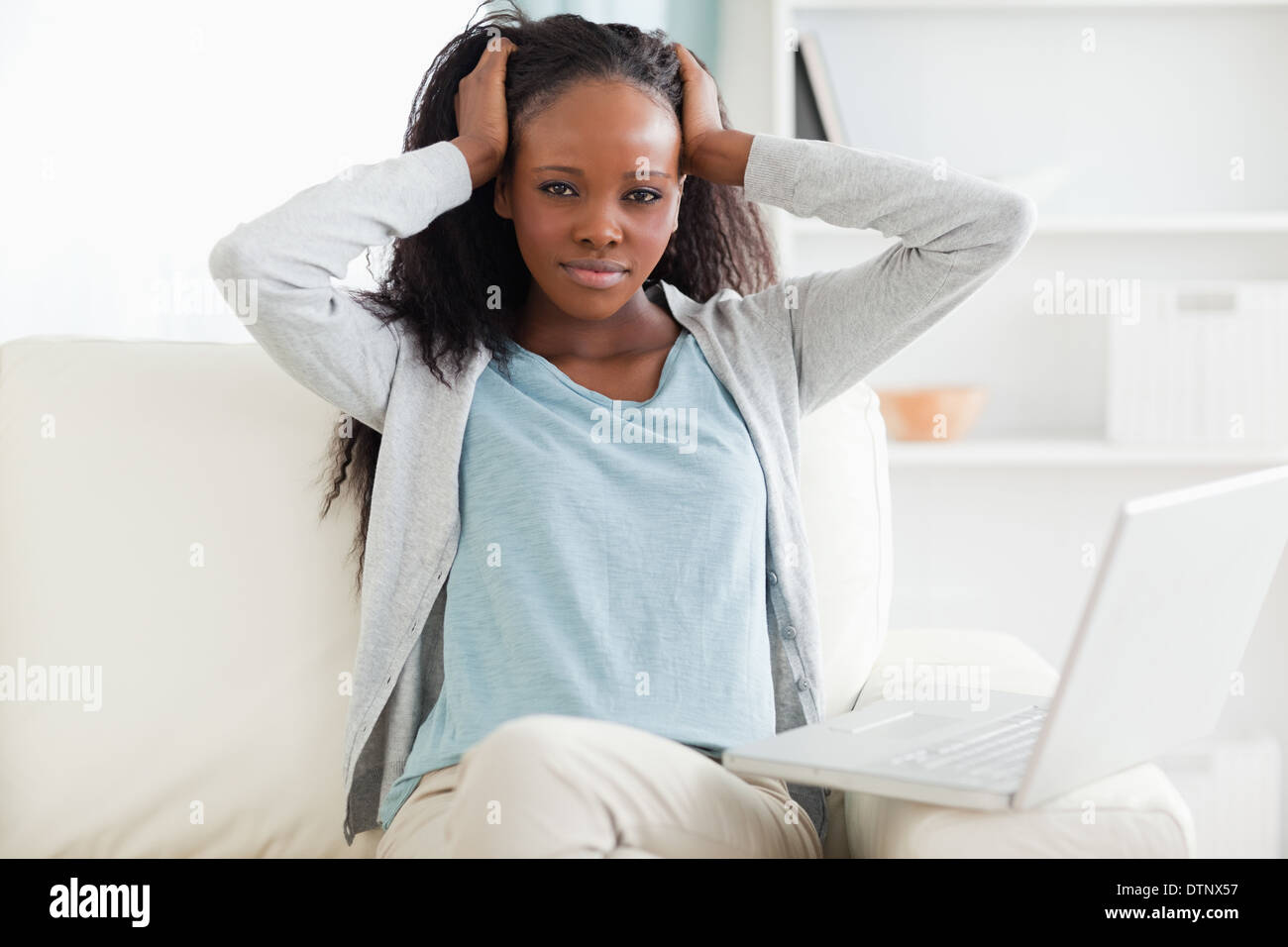 Woman not happy about her notebook Stock Photo - Alamy