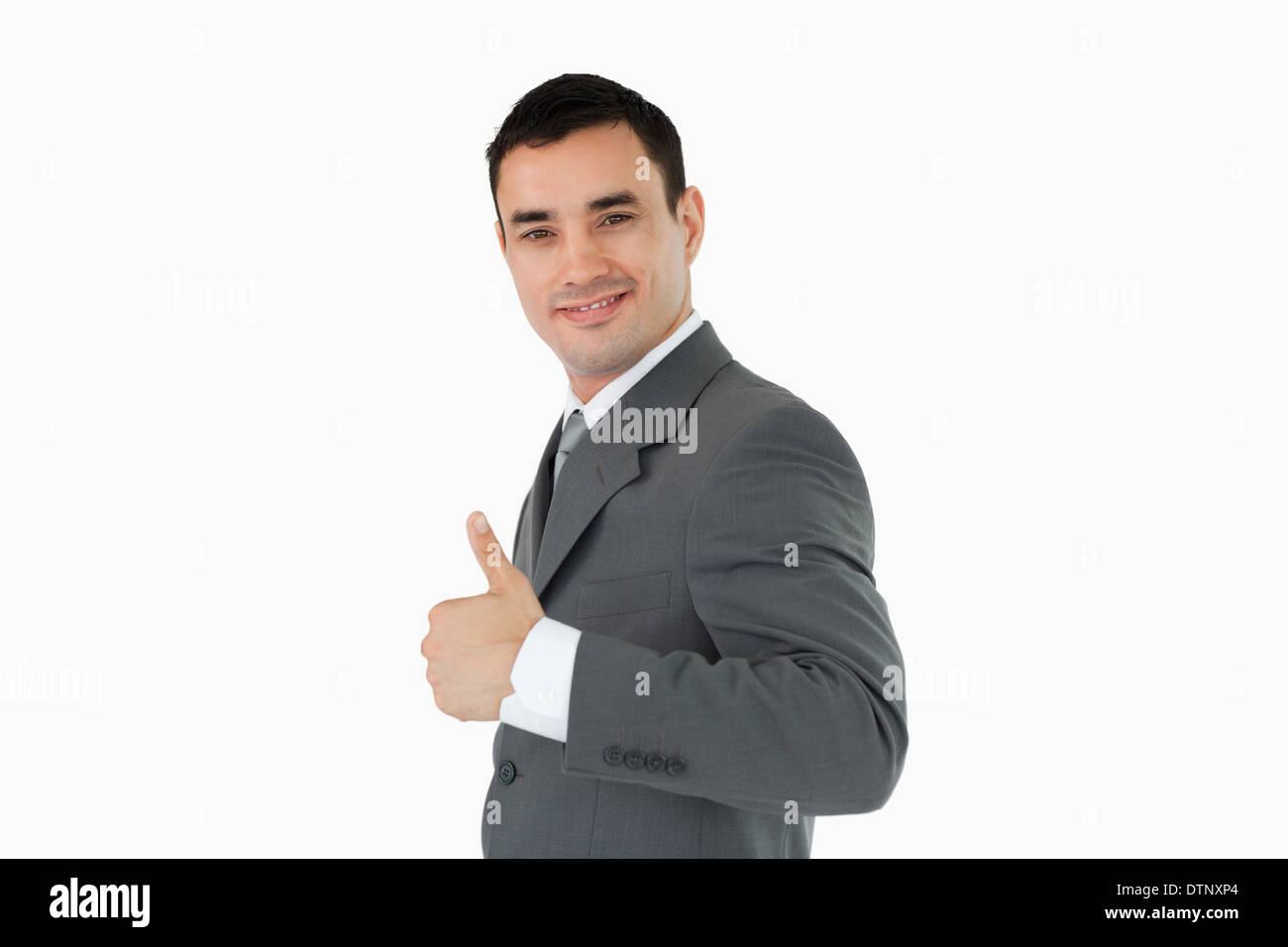 Side view of businessman giving thumb up Stock Photo - Alamy