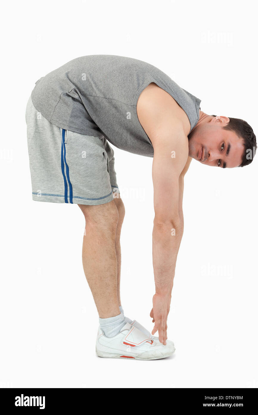 Portrait of a man stretching up Stock Photo - Alamy