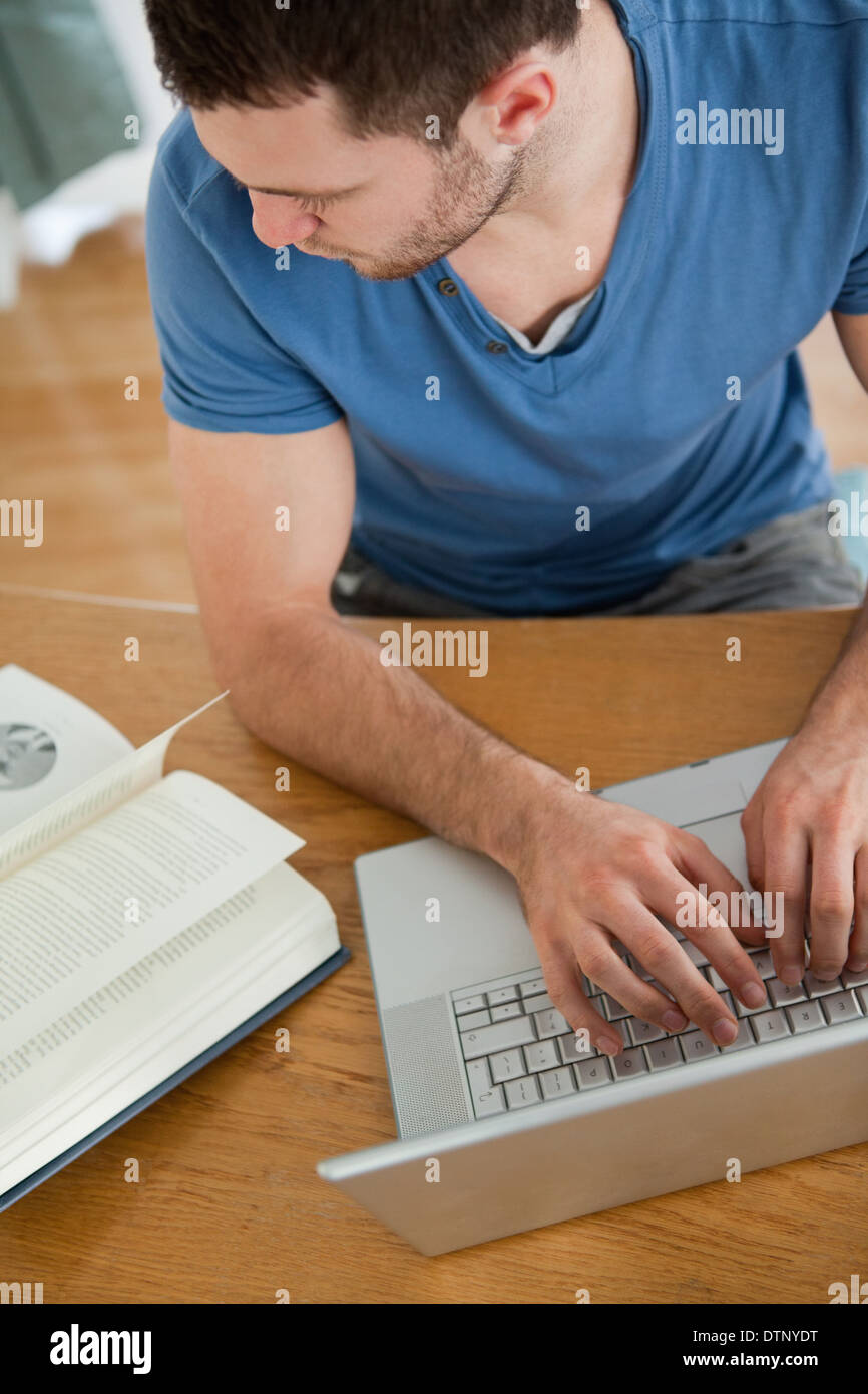 Student copying something from his book Stock Photo - Alamy