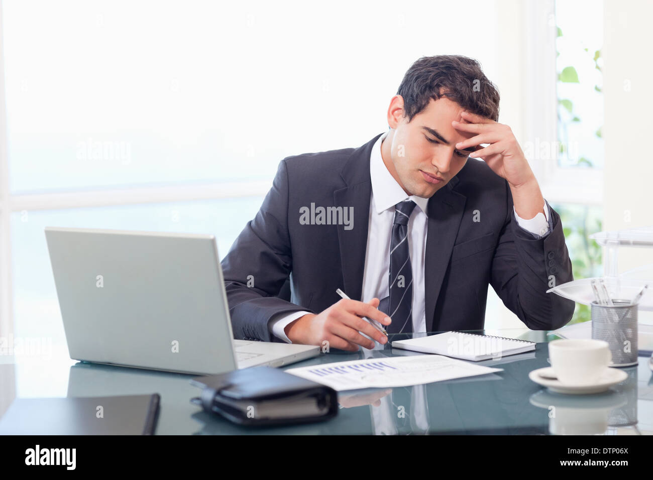 Focused businessman working Stock Photo - Alamy