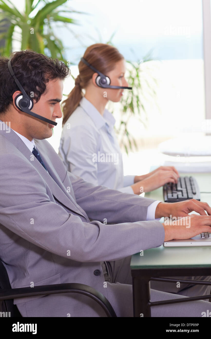 Call center agents at work Stock Photo - Alamy