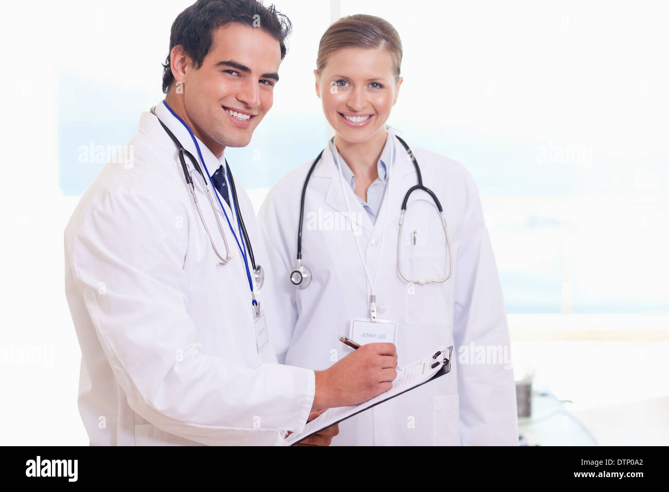 Medical team taking notes Stock Photo - Alamy