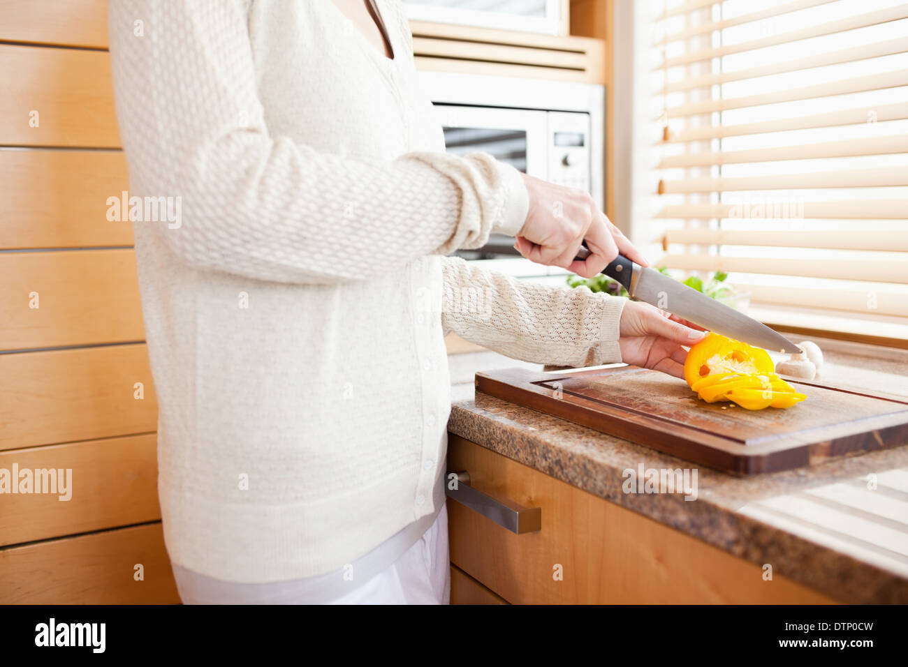 Pepper bell getting cut Stock Photo - Alamy